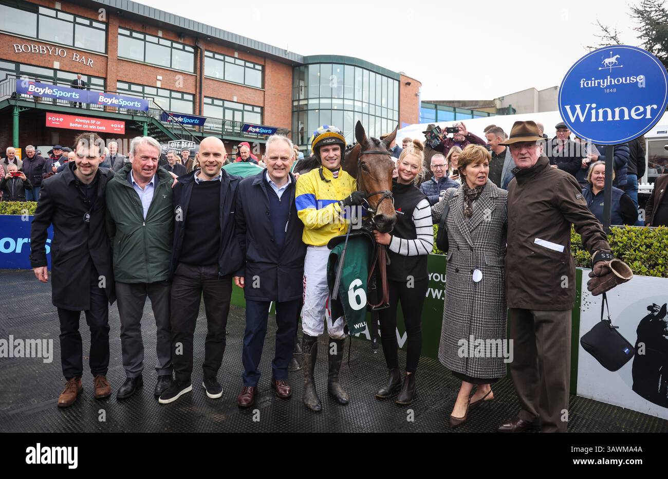 Jockey Danny Mullins (fifth left) with winning connections after riding ...