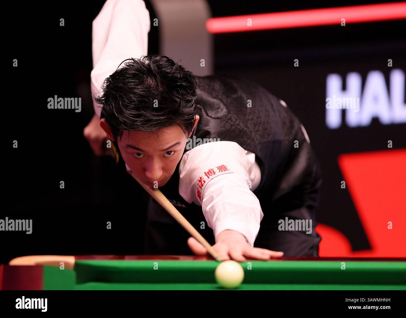 Wu Yize during his match against Mark Williams (not pictured) during day two of the Halo World ...