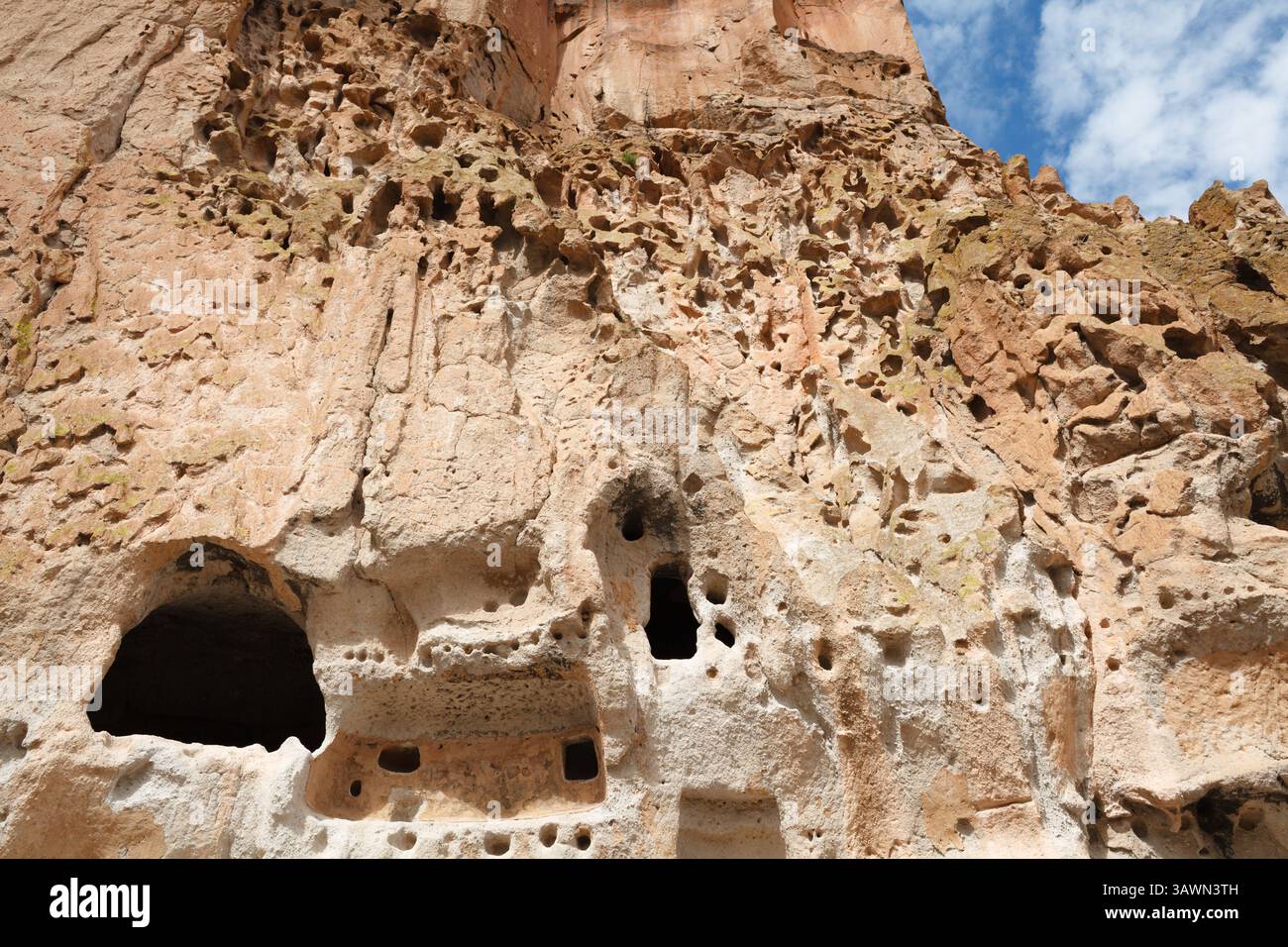Ancient cliff dwelling ruins and eroding canyon walls at Bandelier ...