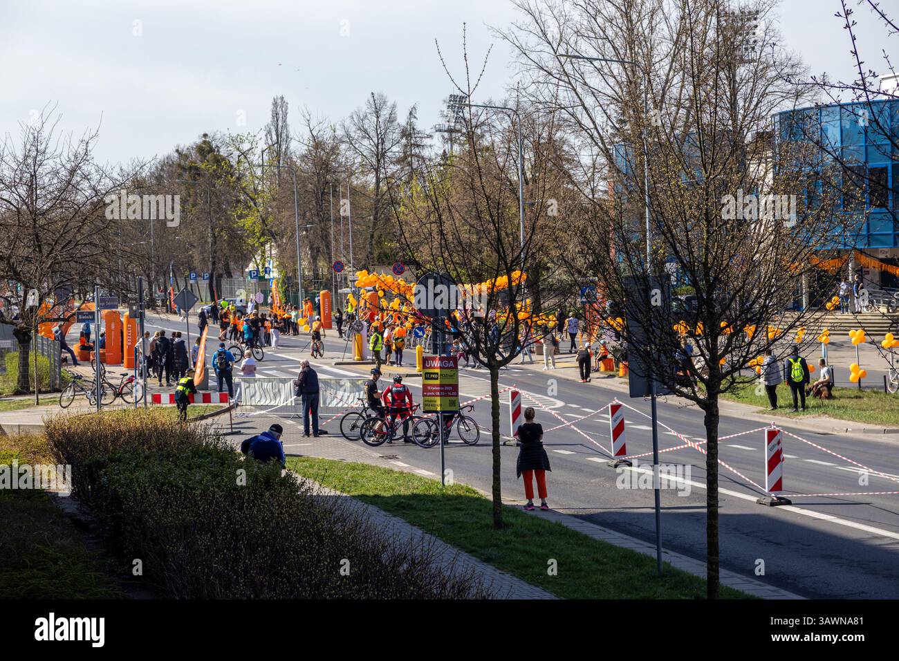 Poznan, Poland - April 13, 2025: Large group of runners and cyclists ...