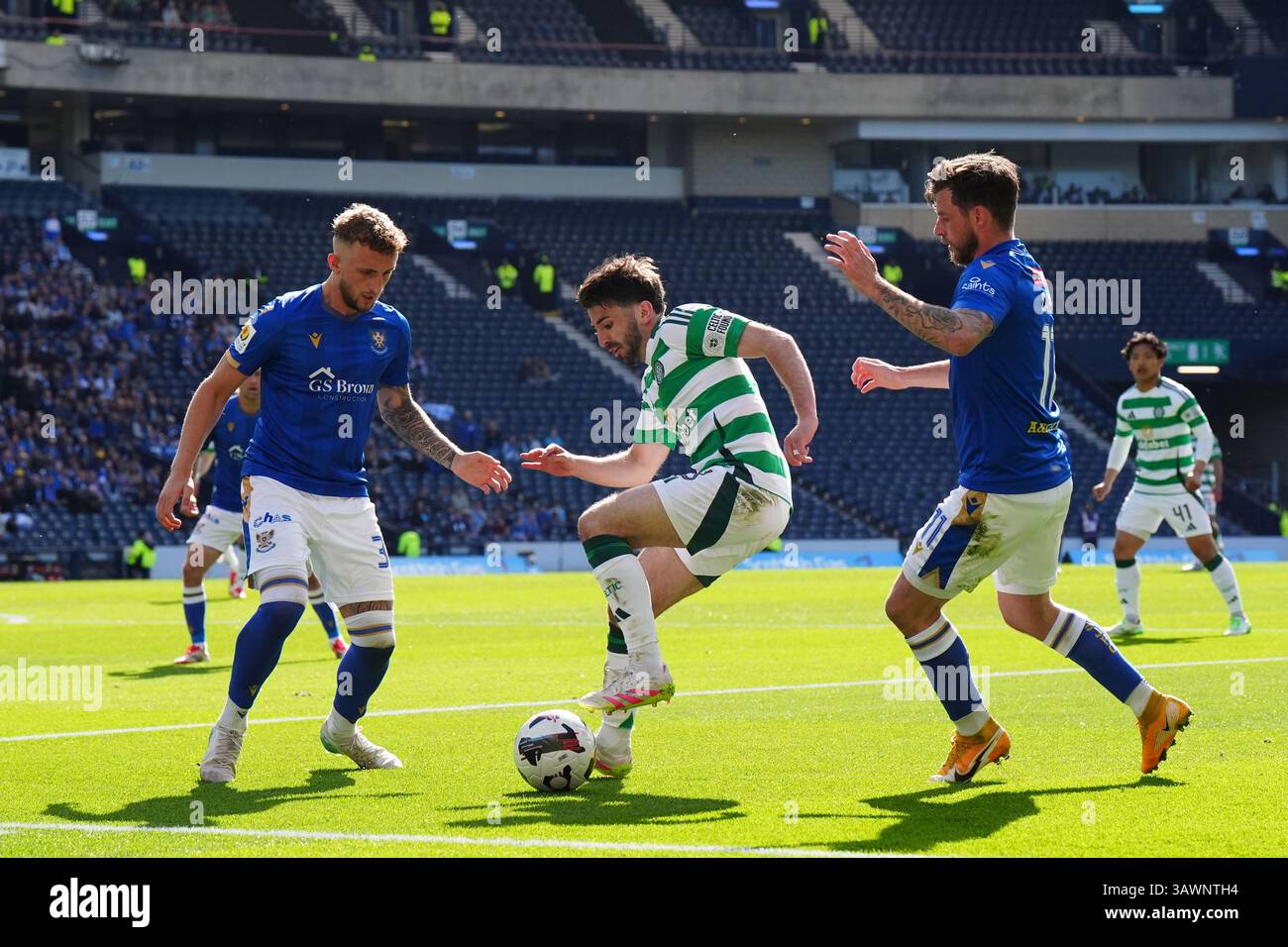 Celtic’s Greg Taylor (centre) battles for the ball against St Johnstone ...