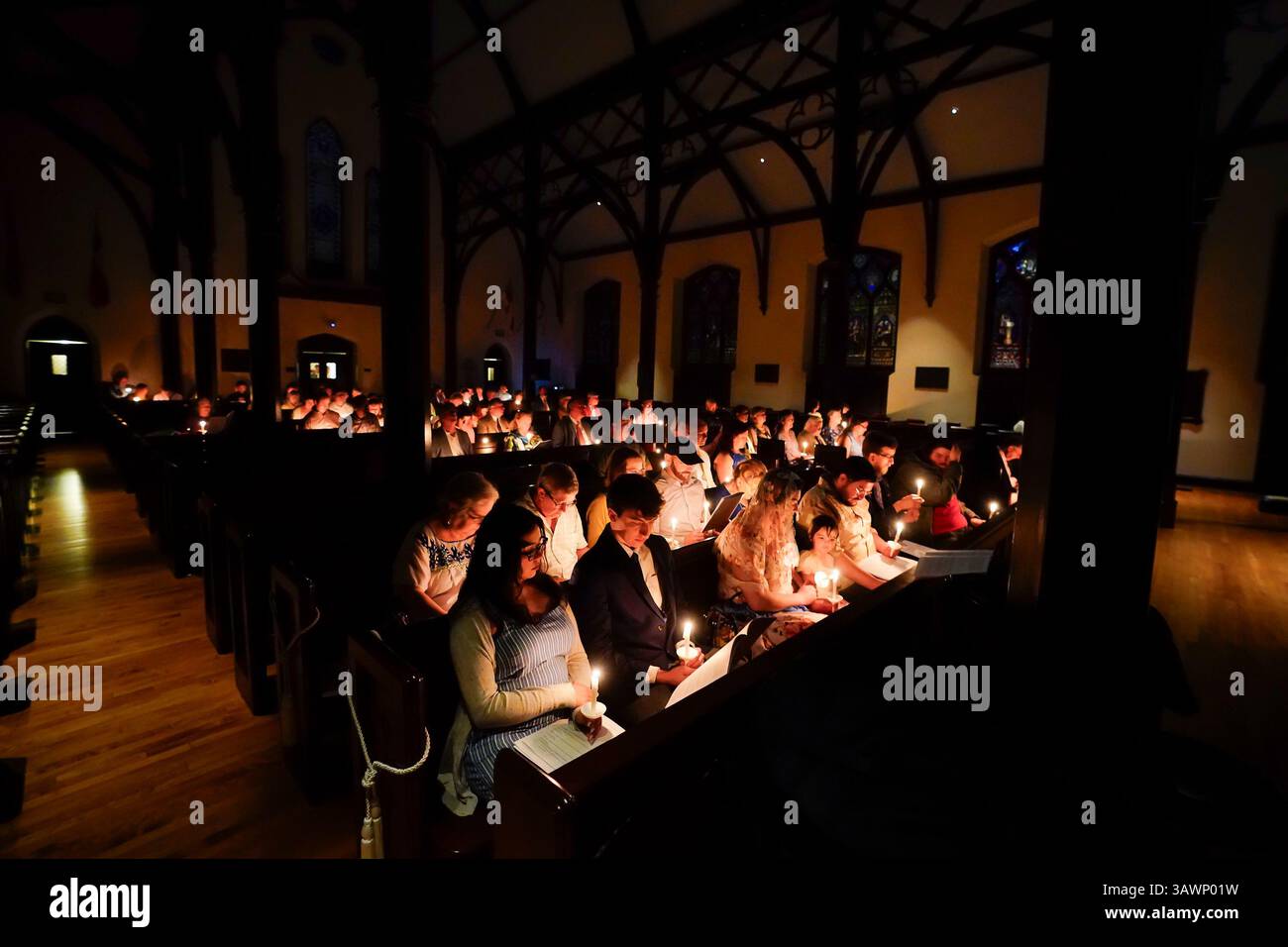Parishioners hold candles during St. Mark's Episcopal Church's ...