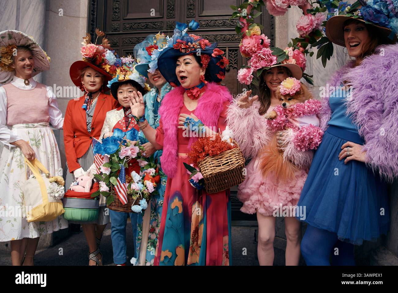 Revelers wearing decorated hats and costumes participate in the annual ...