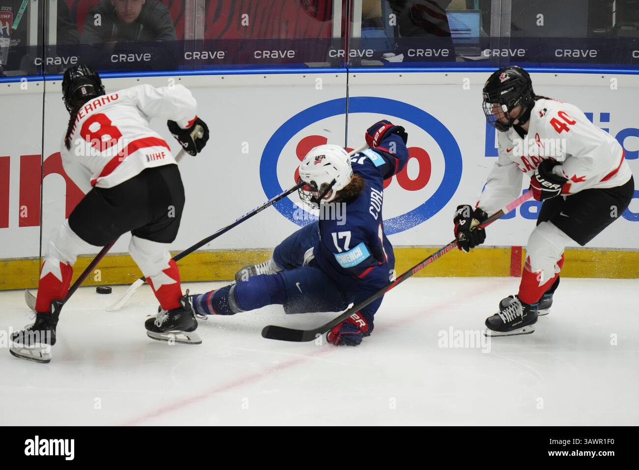 United States' Britta Curl falls between Canada's Chloe Primerano, left ...