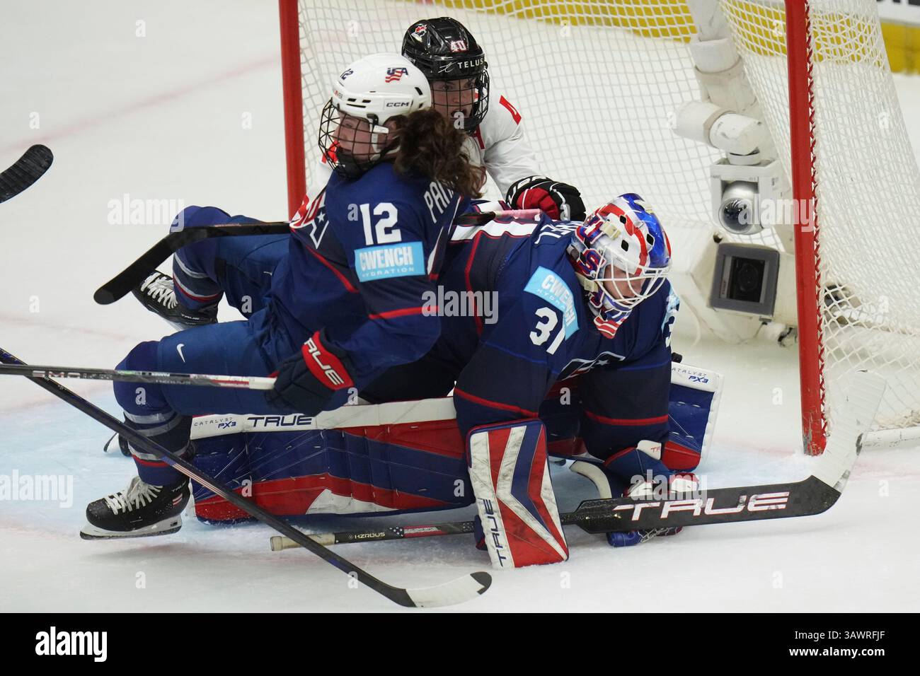United States' Kelly Pannek falls over goalkeeper Aerin Frankel during ...