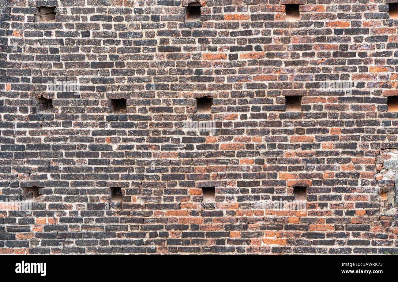A close-up view with the medieval brick wall part of the historic ...
