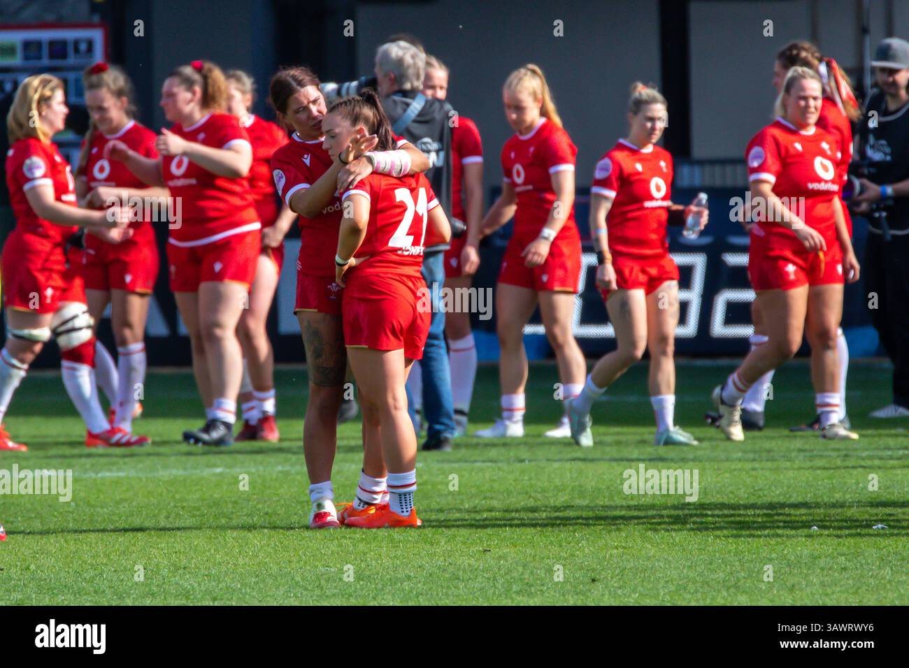 Newport, UK, 20th April 2025 Wales forward Goergia Evans comforts team ...