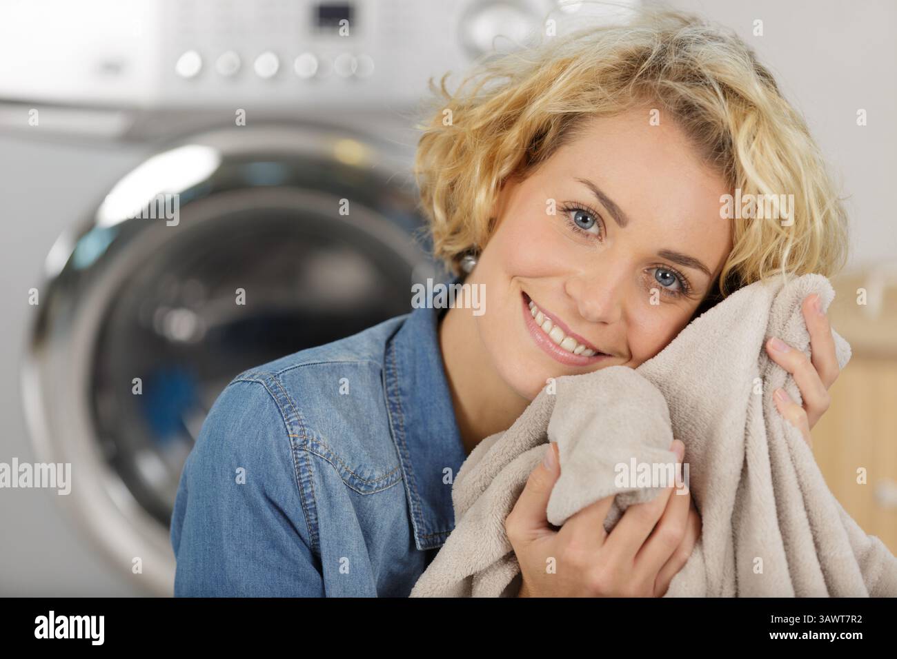 happy woman with fresh laundry Stock Photo - Alamy