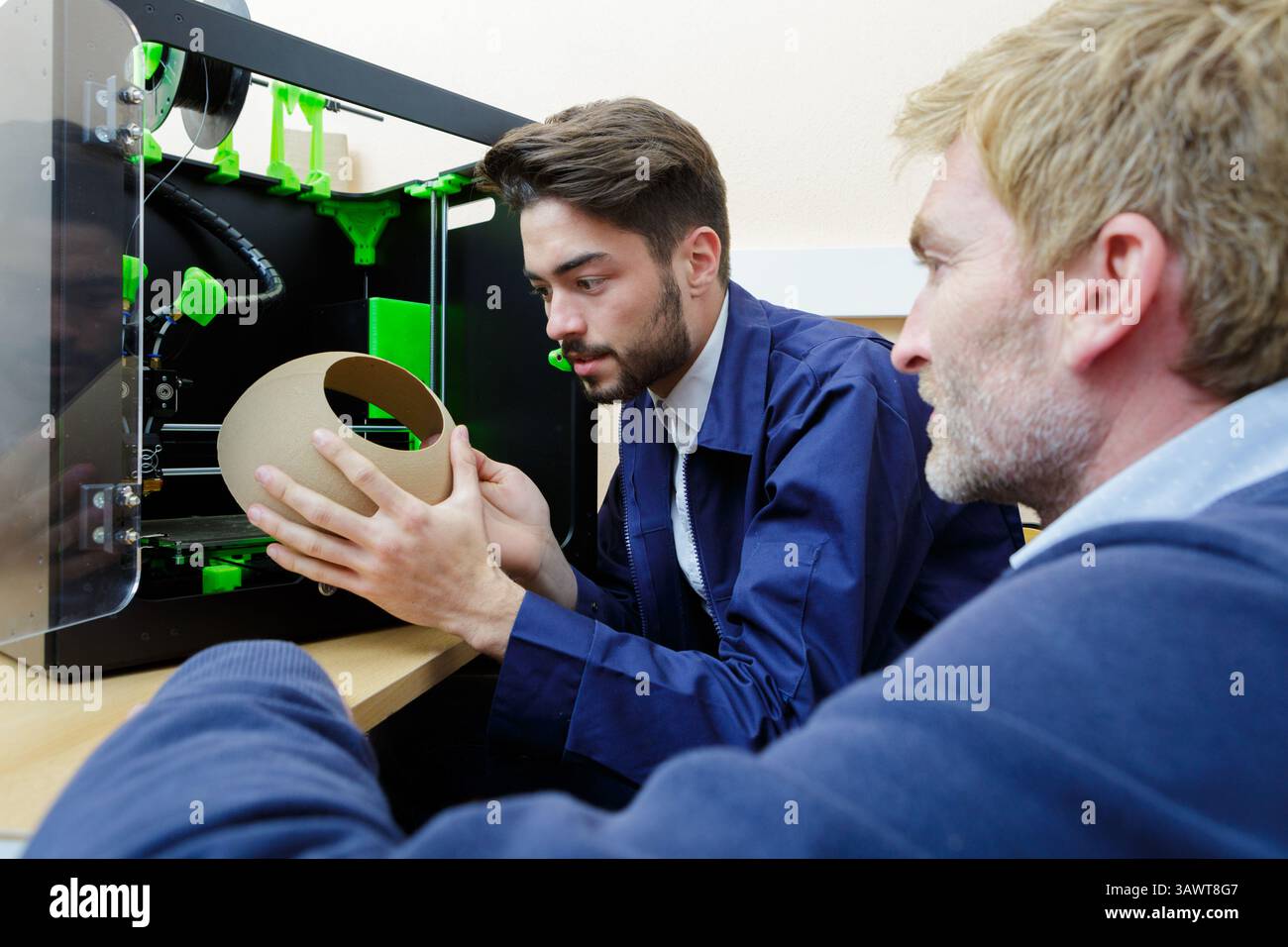 two male designers working with 3d printer Stock Photo - Alamy