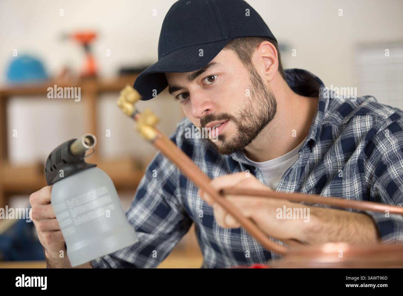 plumber using gas torch to solder copper pipes Stock Photo - Alamy
