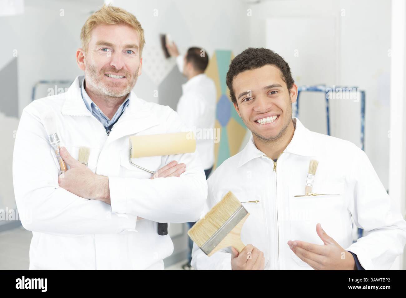 a painter with an apprentice Stock Photo - Alamy