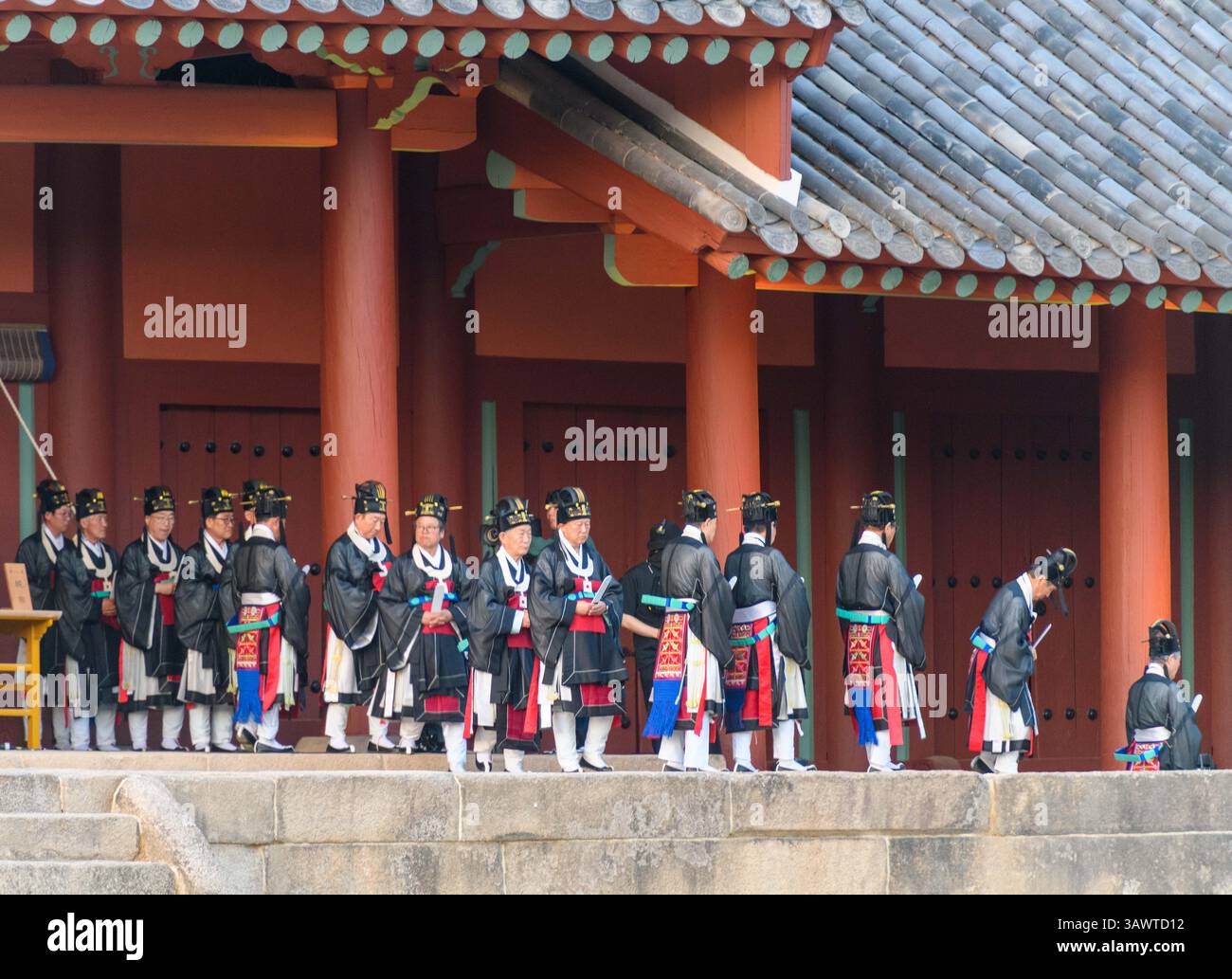 Ritual officials are seen participating in a ceremony to return the ...