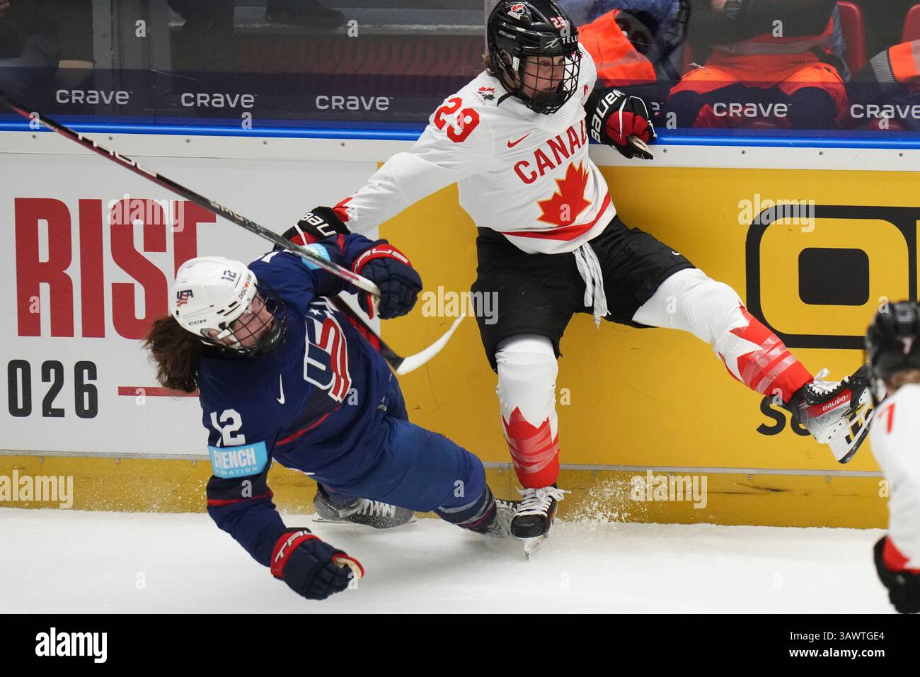 United States' Kelly Pannek falls by Canada's Marie-Philip Poulin ...