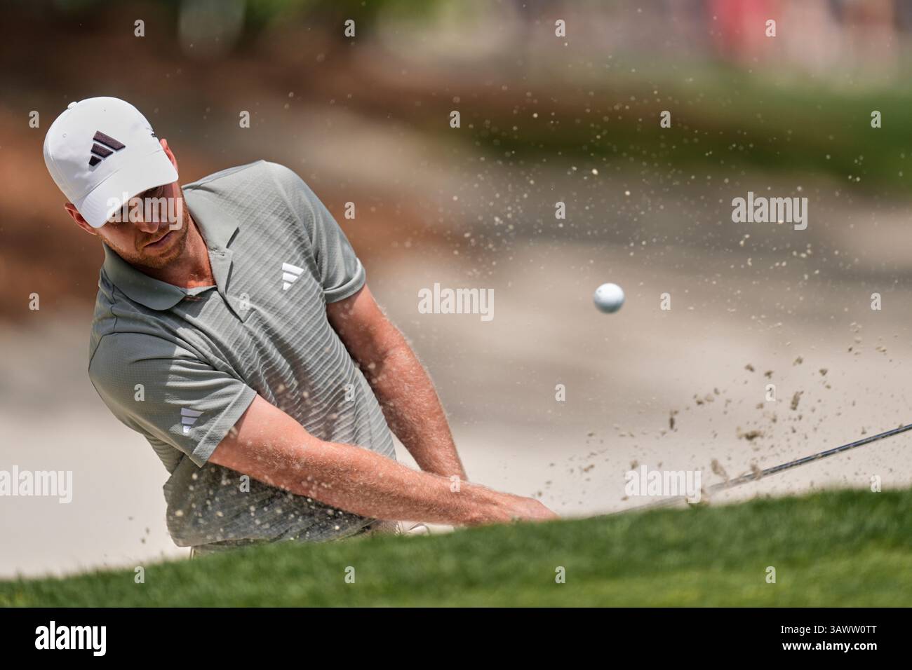 Daniel Berger hits out of the bunker on the second hole during the ...