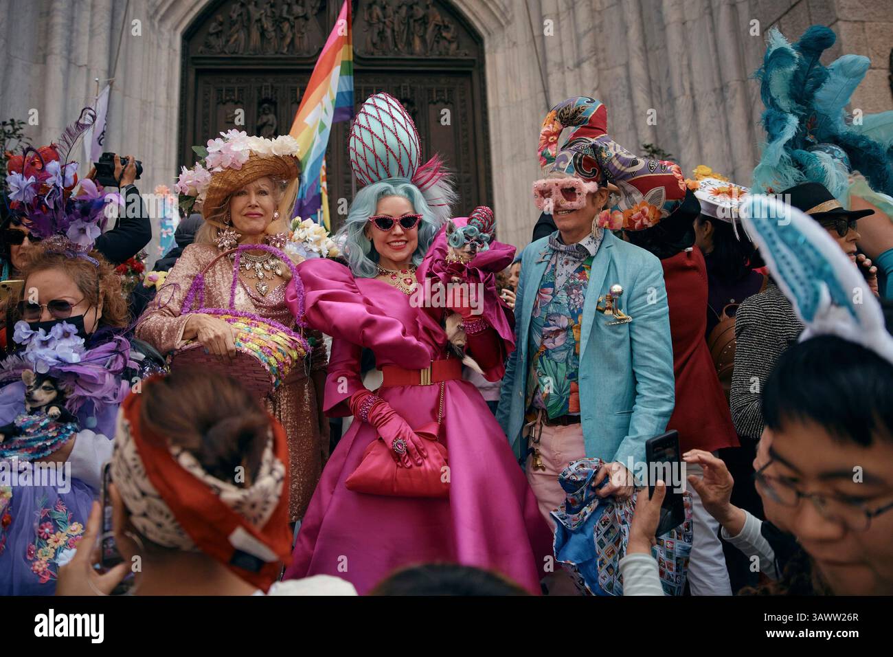 Revelers wearing decorated hats and costumes participate in the annual ...