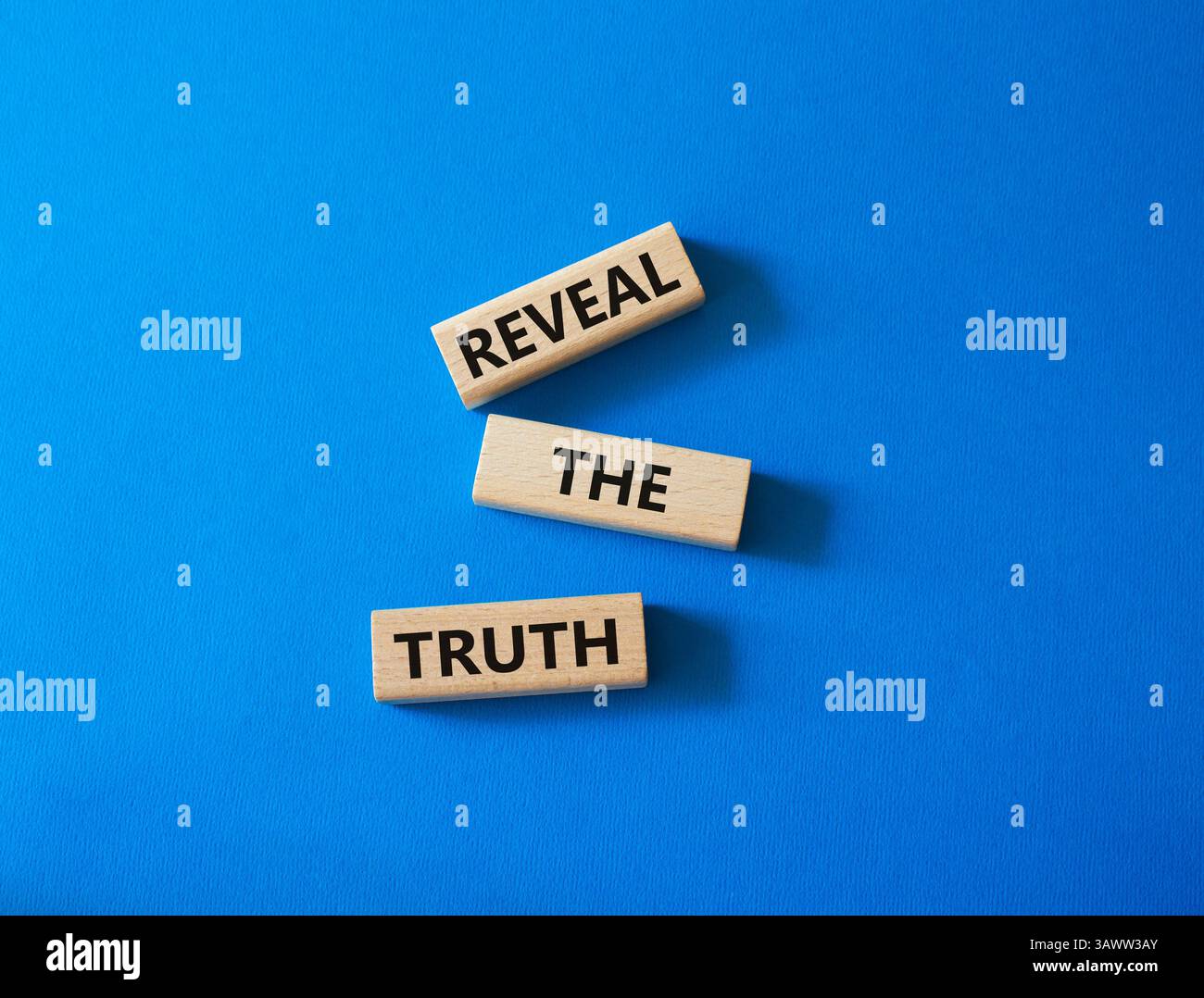 Reveal the truth symbol. Concept word Reveal the truth on wooden blocks ...