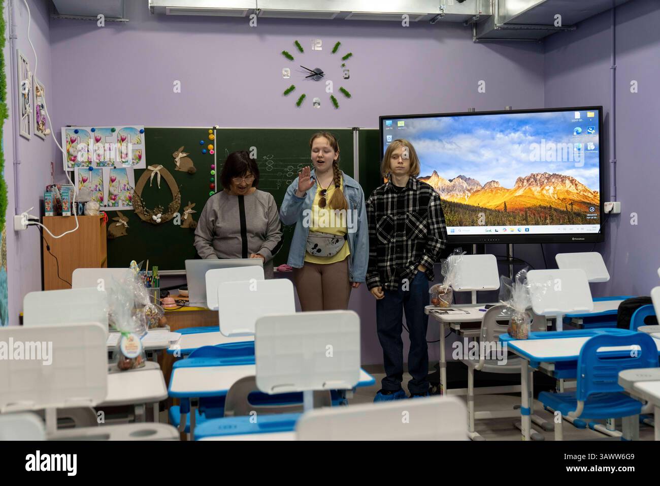 Students attend a singing class on Easter weekend in a newly ...