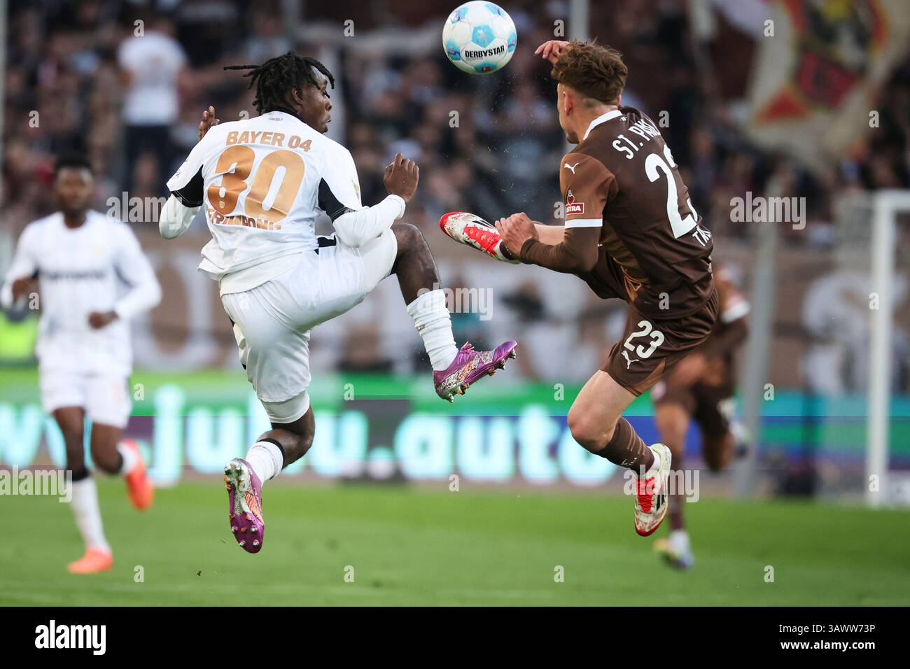 St. Pauli's Philipp Treu, right, and Leverkusen's Jeremie Frimpong in ...