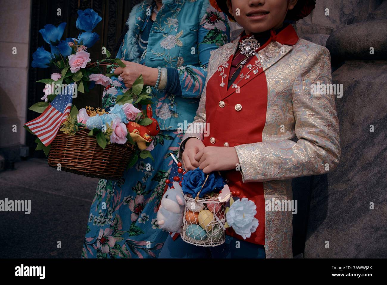 Revelers wearing decorated hats and costumes participate in the annual ...