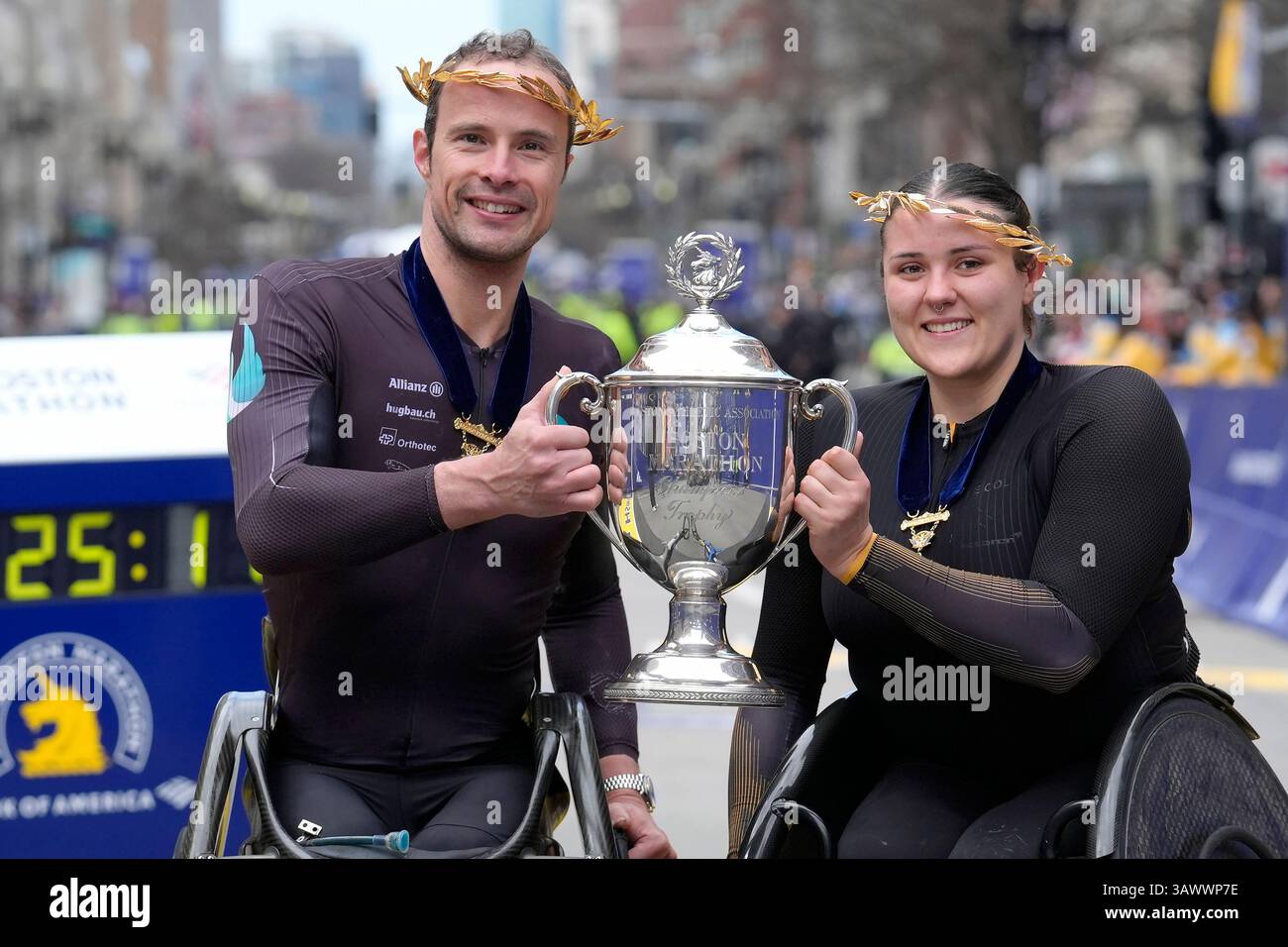 FILE - Marcel Hug, of Switzerland, left, winner of the Boston Marathon ...