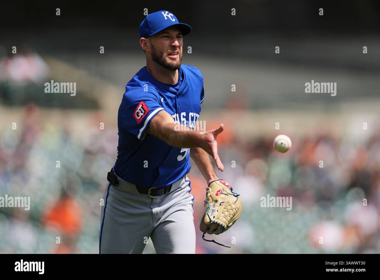 Kansas City Royals pitcher Michael Wacha tosses the ball to first base ...