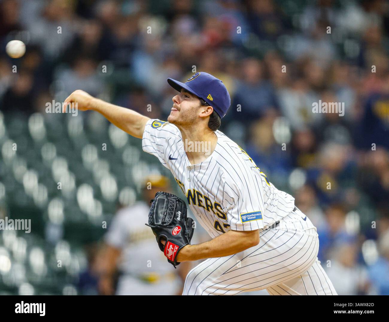 Milwaukee Brewers starting pitcher Logan Henderson throws to the ...