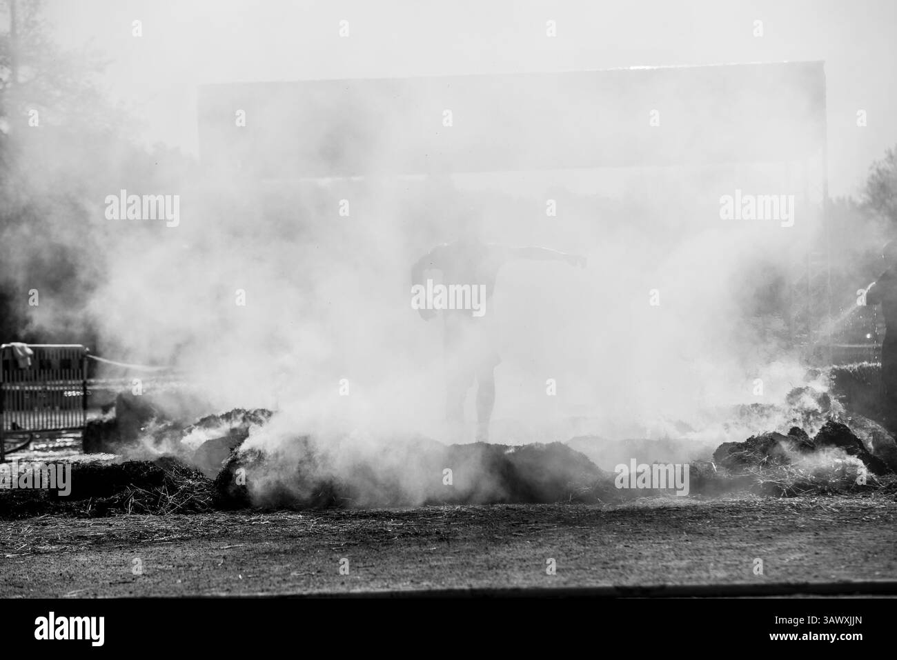 Athlete barely visible in thick smoke Stock Photo - Alamy