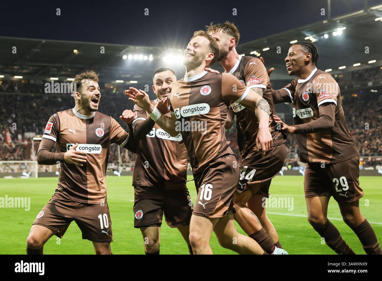 St. Pauli's Carlo Boukhalfa, center, celebrates scoring with teammates ...