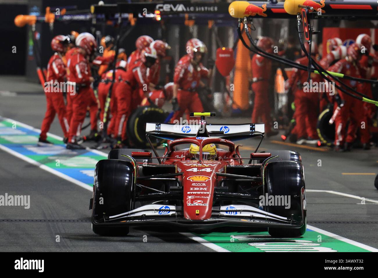Ferrari driver Lewis Hamilton of Britain steers his car after a pit ...