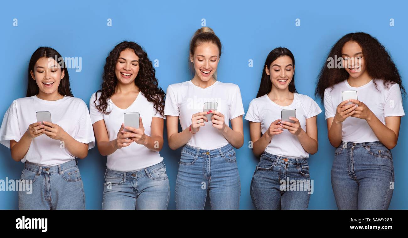 Five Happy Multiracial Females Using Phones Standing On Blue Background ...
