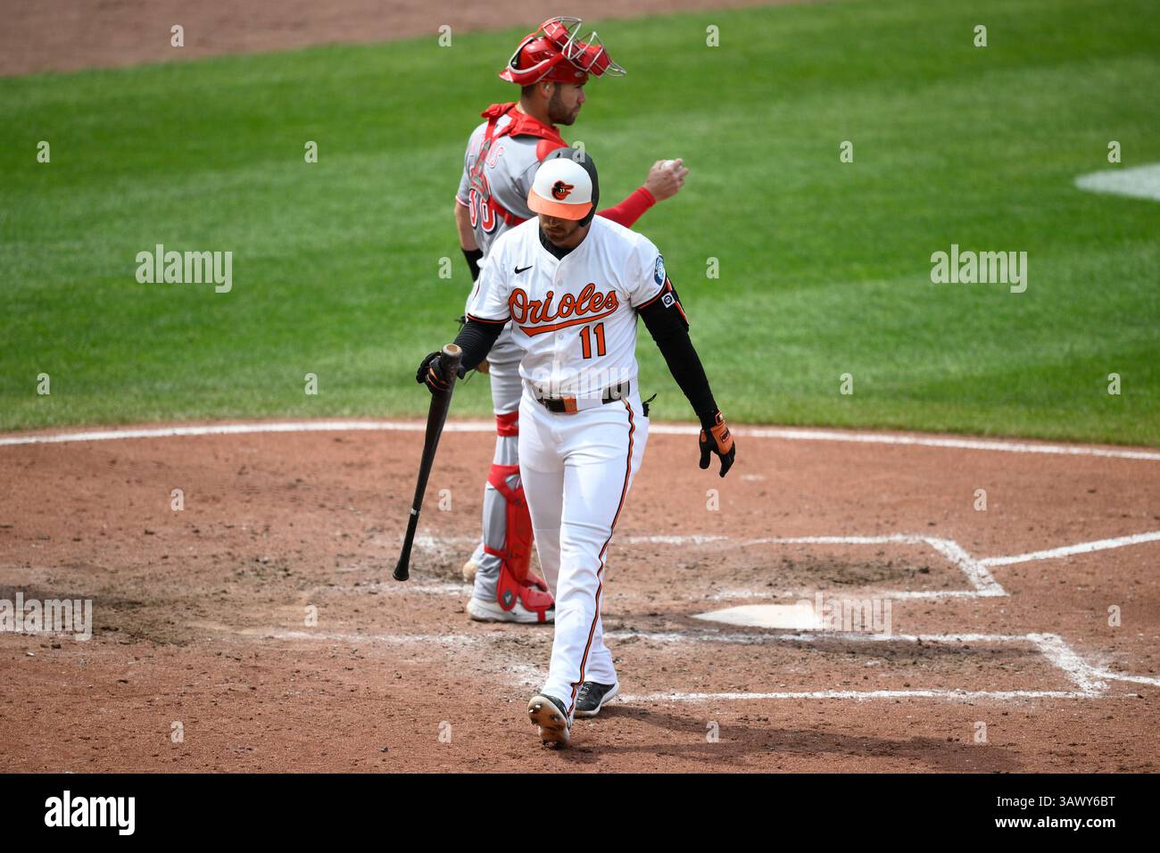 Baltimore Orioles' Jordan Westburg, front, walks back to the dugout ...