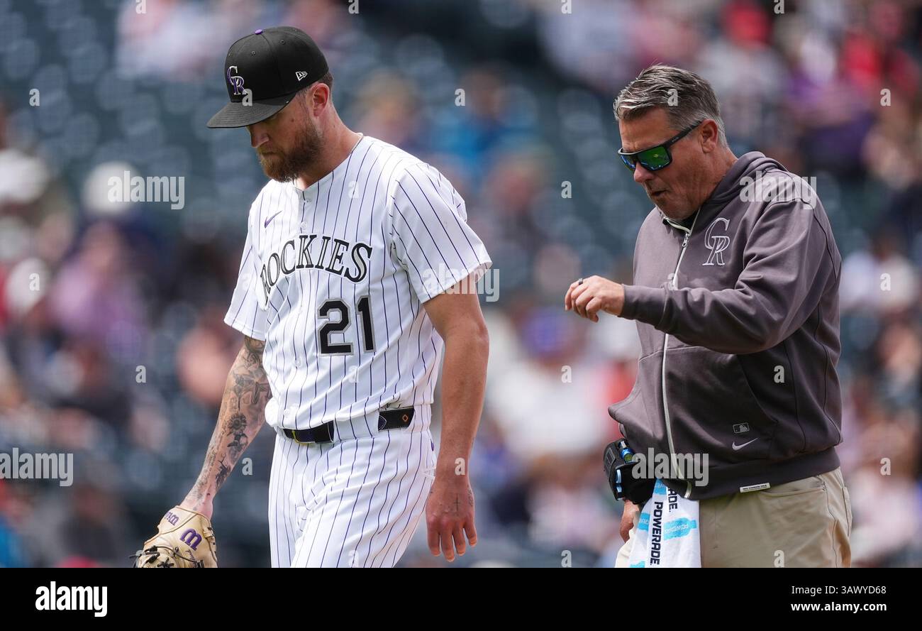 Colorado Rockies starting pitcher Kyle Freeland, left, heads to the ...