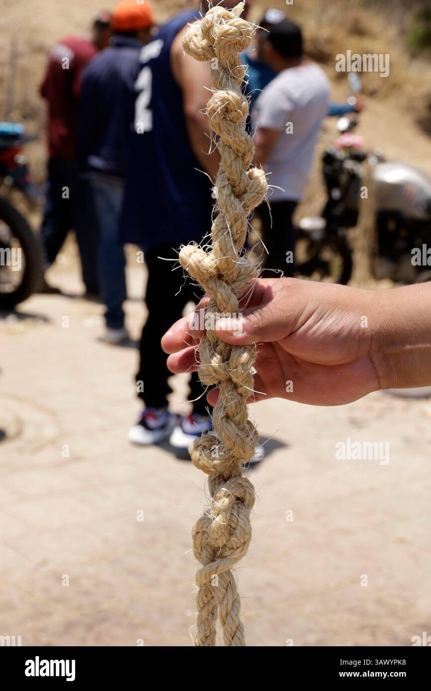 A man shows knotted lasso which is used in the fight of La Gloria de ...