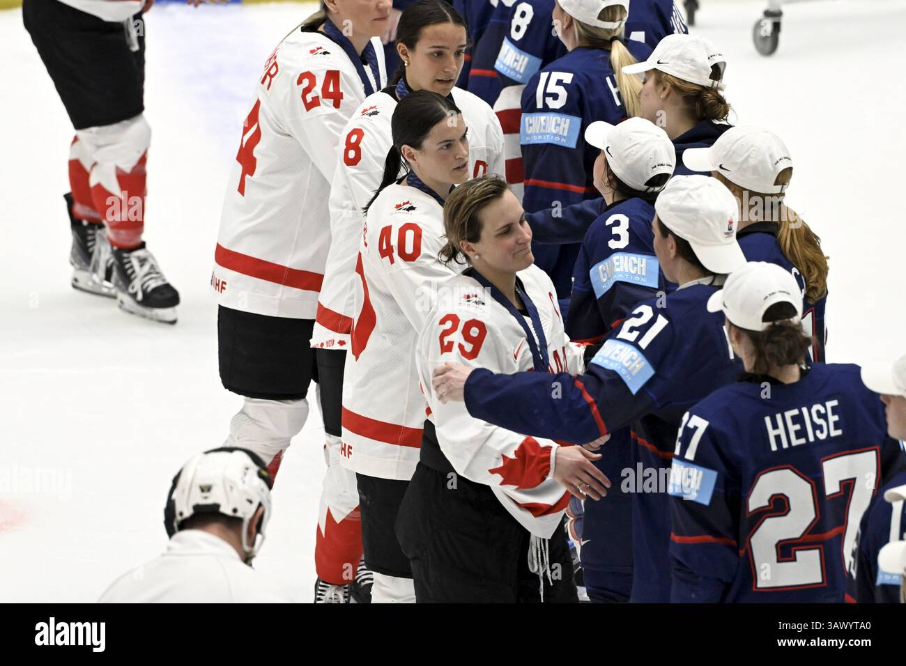Dejected Team Canada (L) and gold-medalists Team USA after the IIHF ...