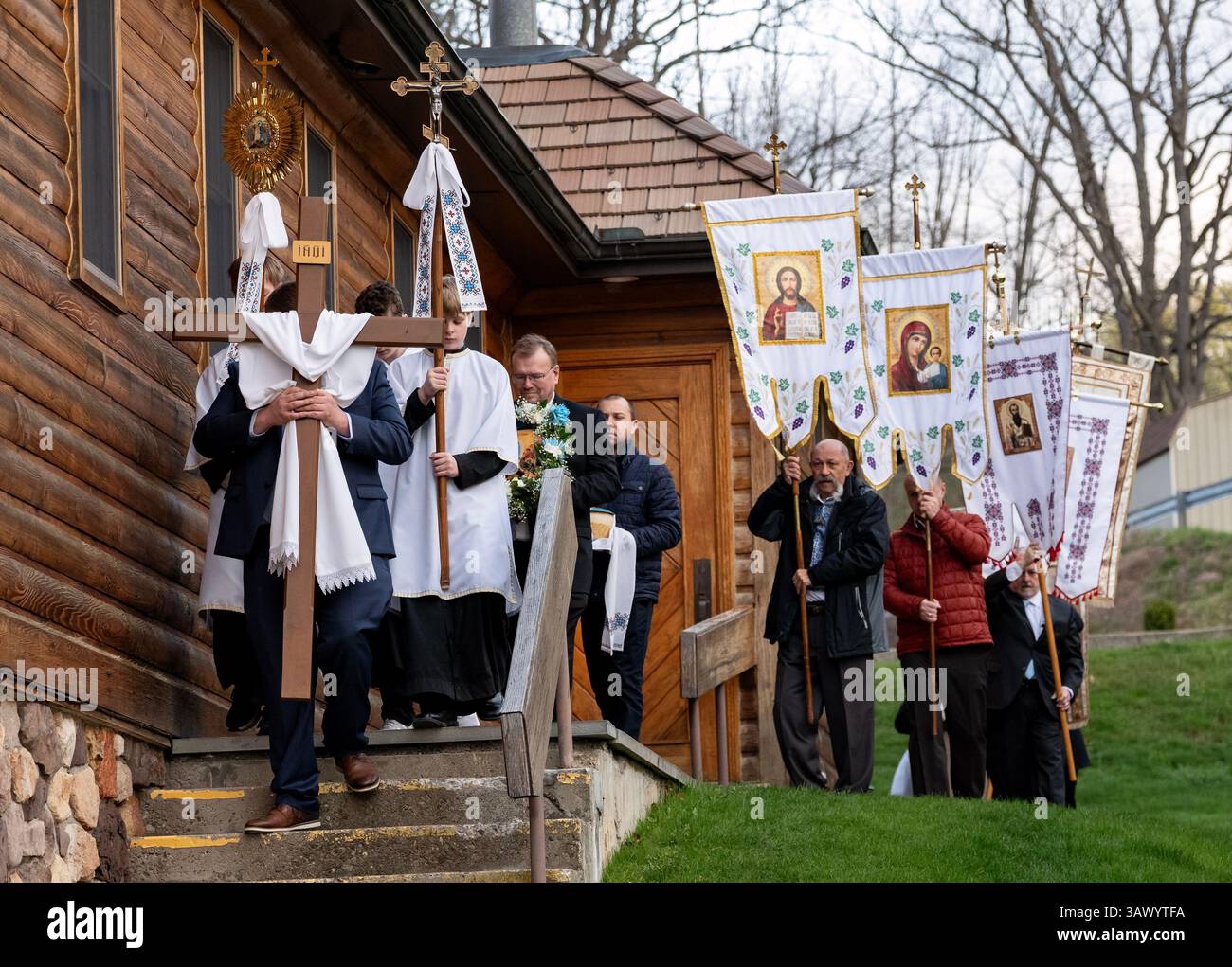 Parishioners of the Sacred Heart Ukrainian Catholic Church take part in an early morning ...