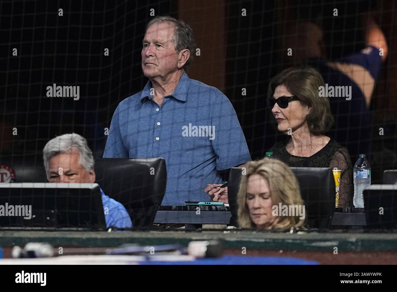 Former President George W. Bush, left, and former first lady Laura Bush ...