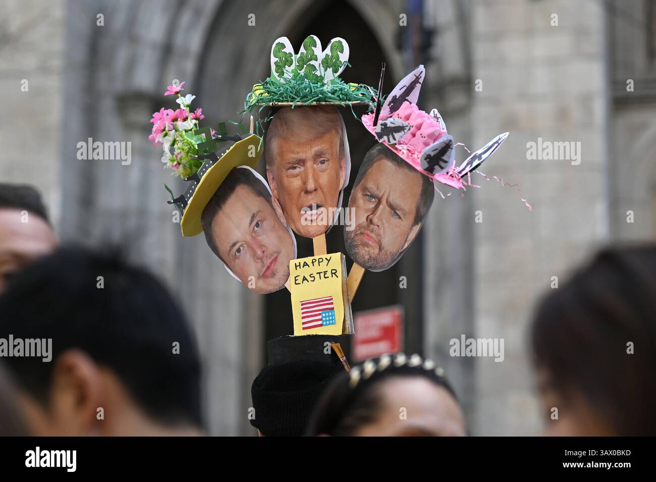 New York, USA. 20th Apr, 2025. A parade participant holds a sign with ...