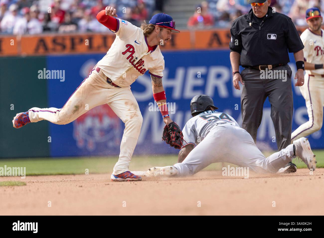 Miami Marlins' Dane Myers (54) is safe at second before Philadelphia ...
