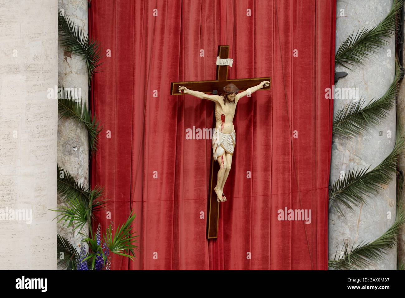 Vatican City , Italy 20.05.2025: Crucifix on the red curtain in the ...
