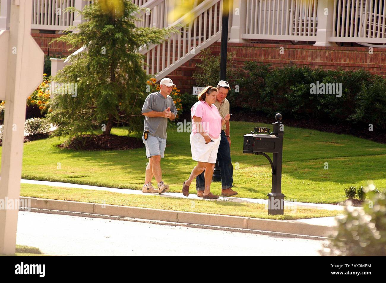 Sep 22, 2003; Smyrna, GA, USA; POLLY SMITH walks with workers in her ...