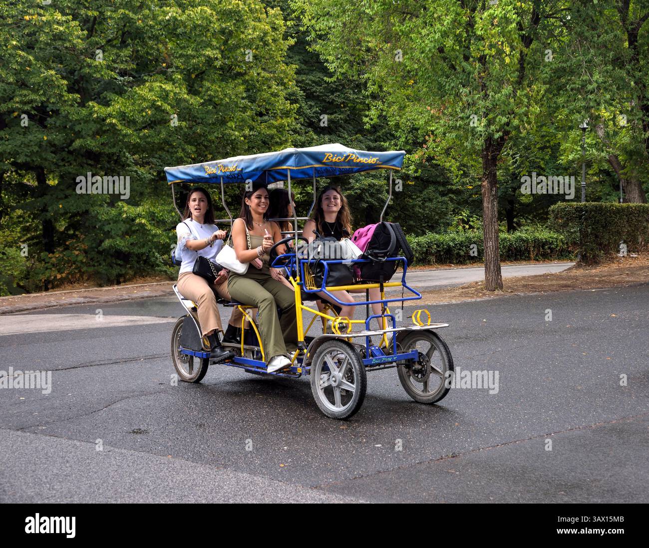 Rome, Italy - September 3, 2022: Roman girls tour a public park in a ...