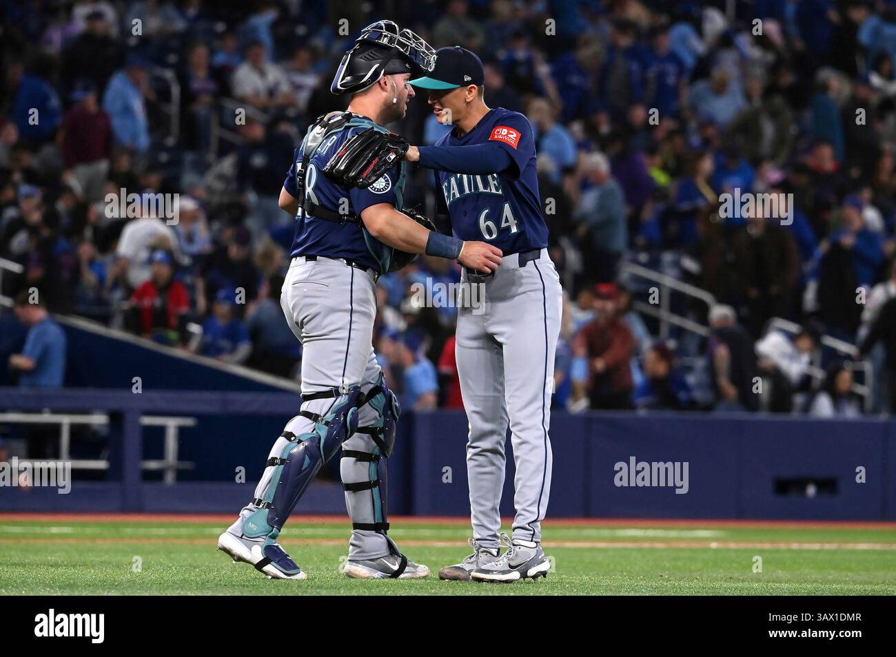 Seattle Mariners catcher Mitch Garver (18) celebrates with relief ...
