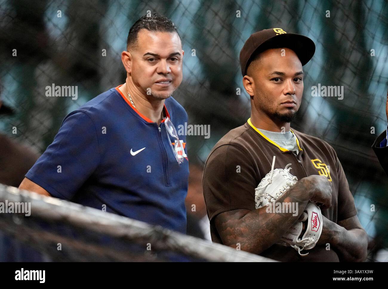 Houston Astros hitting coach Alex Cintron, left, talks with San Diego ...