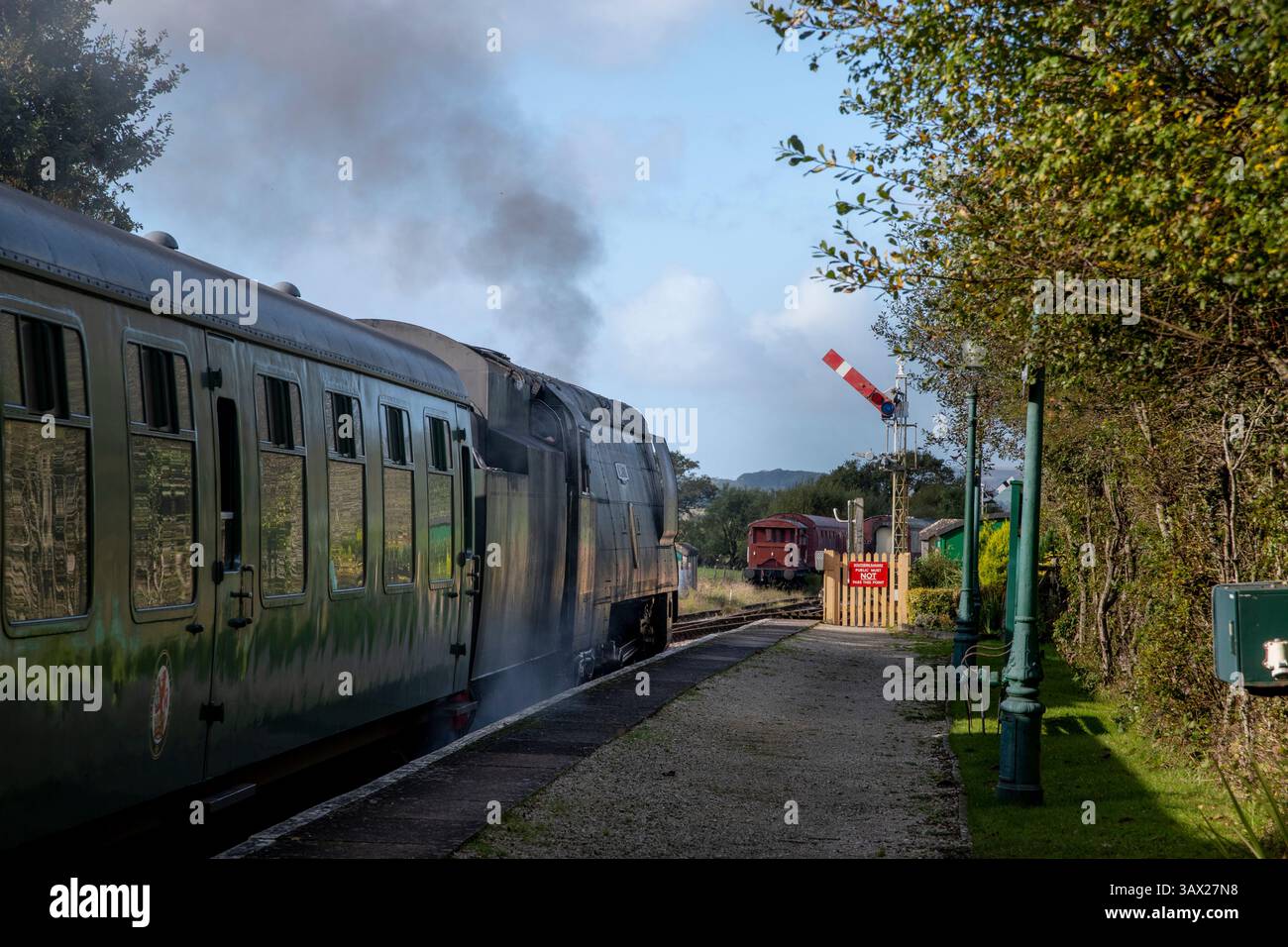 a battle of Britain class pacific locomotive traveling through a ...