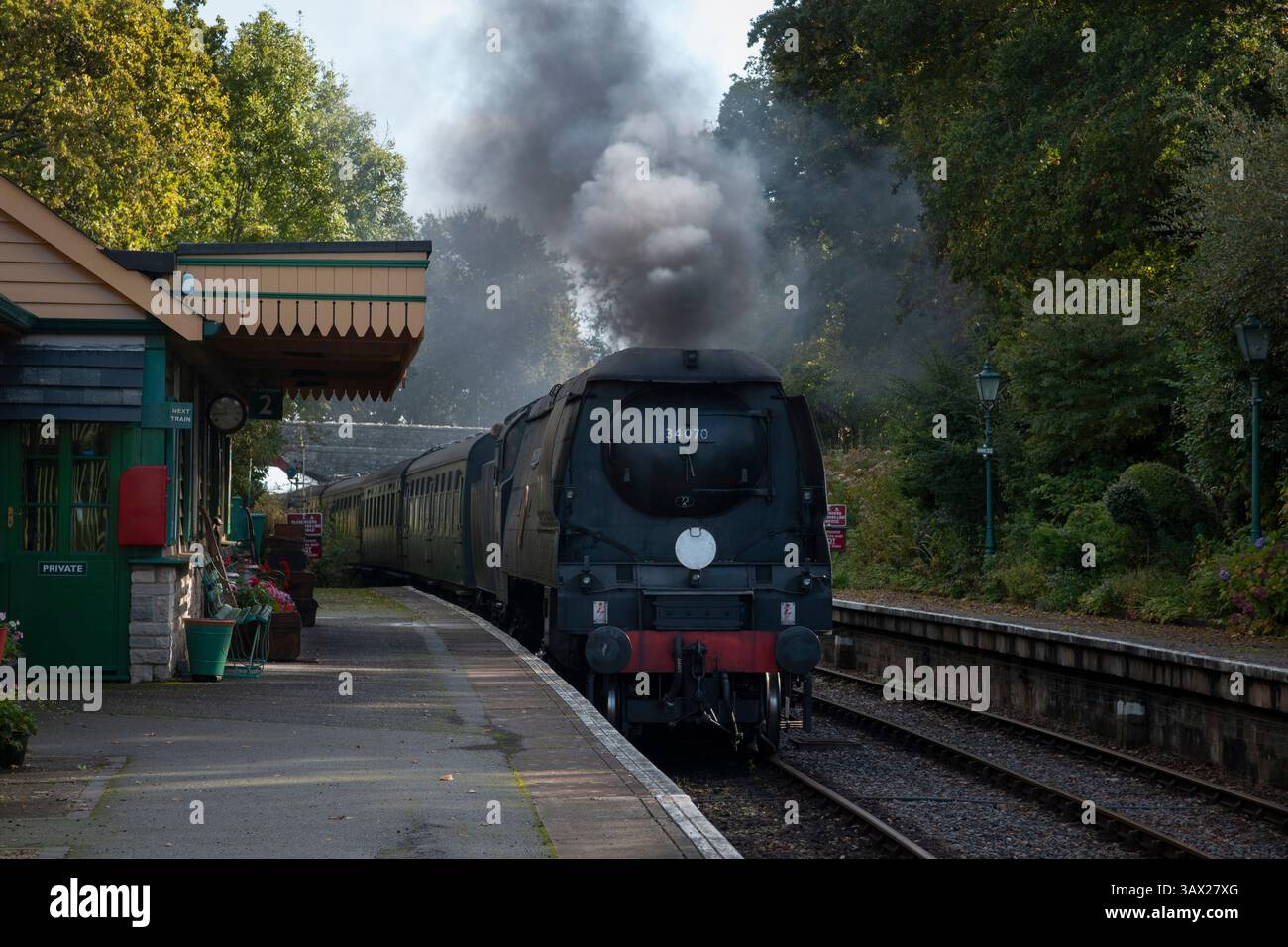 a battle of Britain class pacific locomotive traveling through a ...