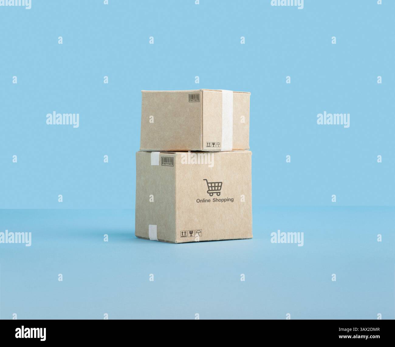 Two stacked cardboard boxes depicting online shopping delivery on a ...