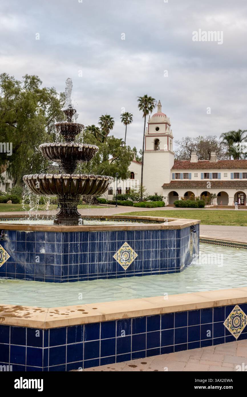 Water fountain with bell tower in background on the campus of ...