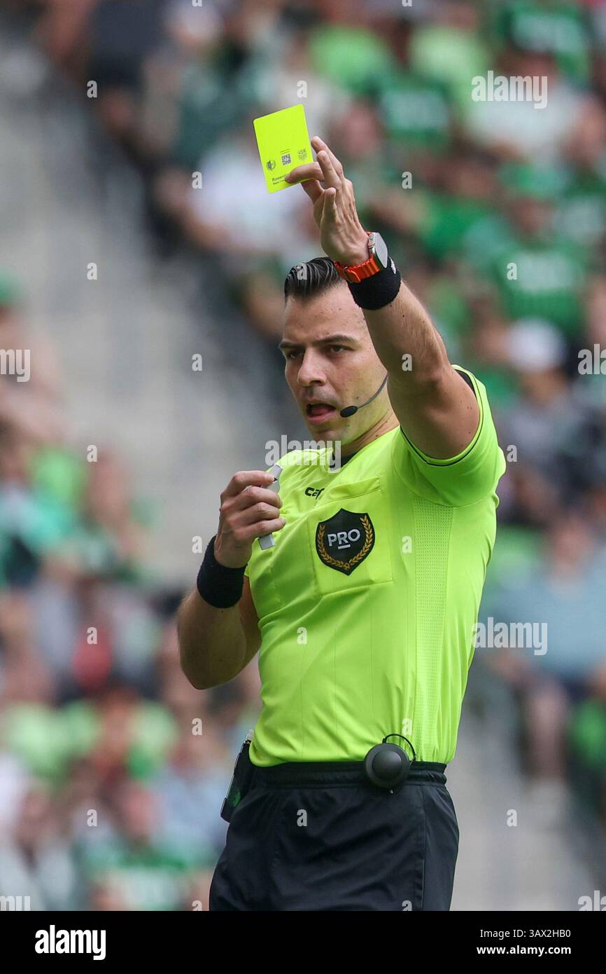 AUSTIN, TX - APRIL 19: The referee holds up a yellow card during the ...
