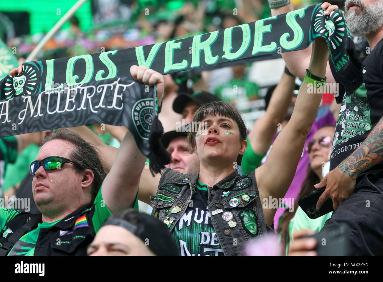 AUSTIN, TX - APRIL 19: An Austin FC fan holds up a Los Verdes banner ...