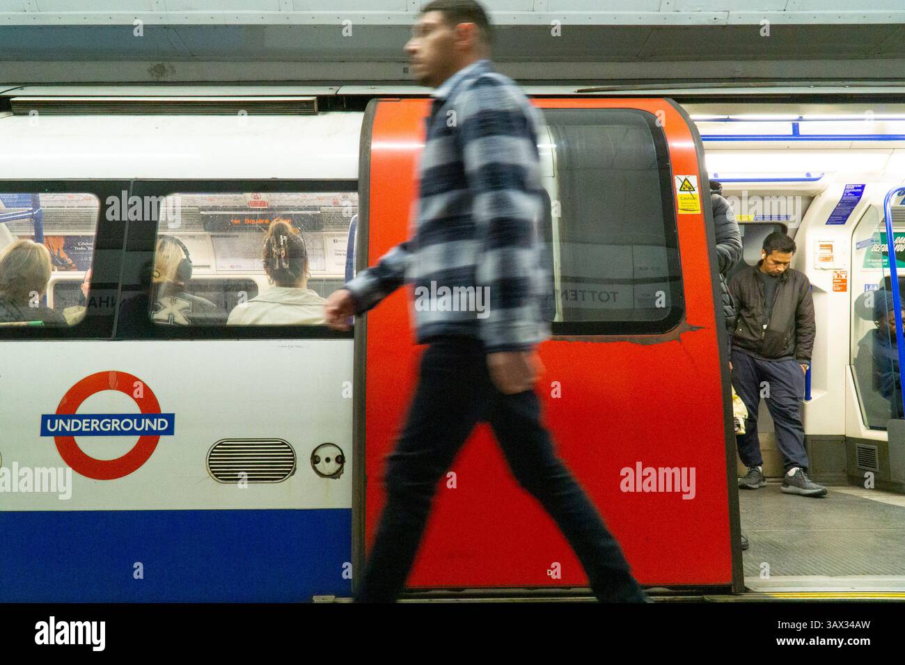 London, UK, 16 April 2025: At Tottenham Court Road station passengers ...